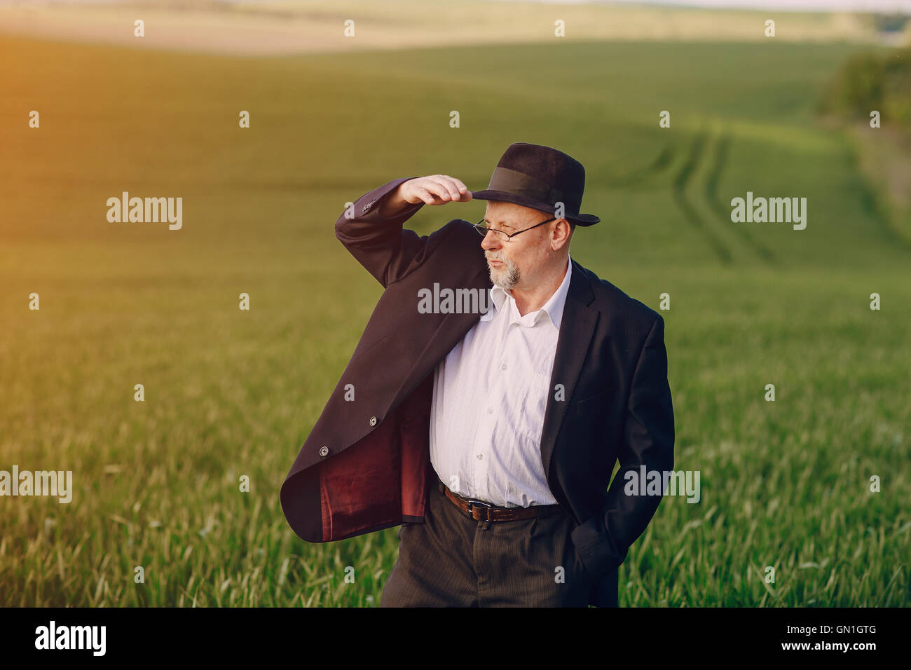 old man in field Stock Photo - Alamy