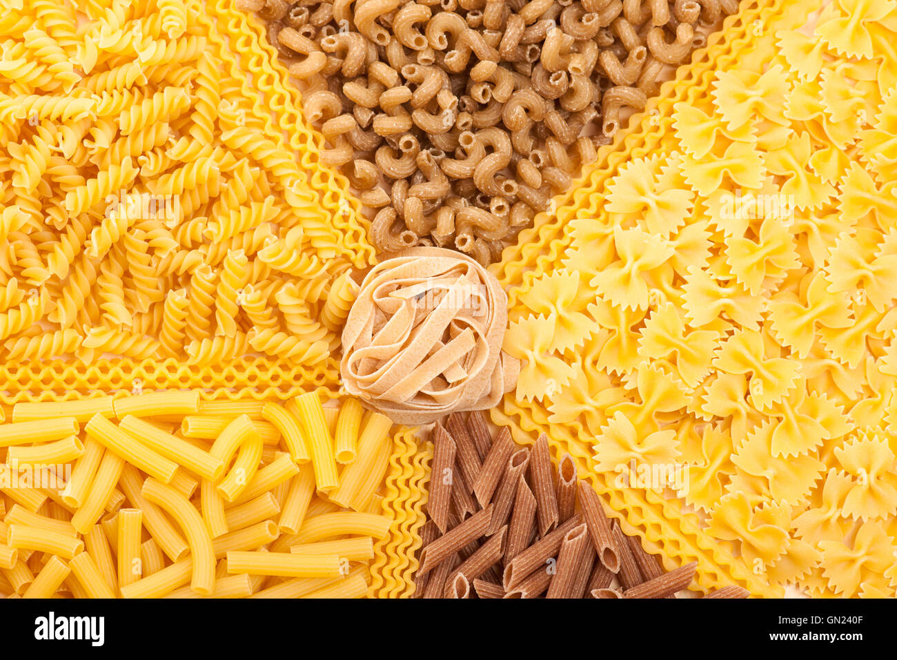 Assortment of italian pasta, five different varieties separated with ...