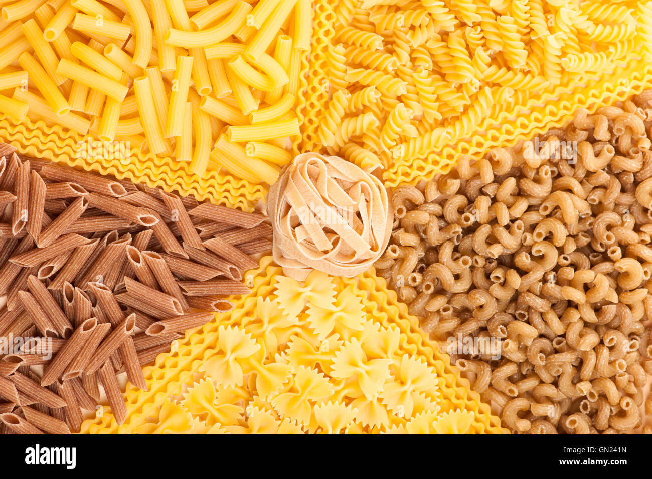 Assortment of italian pasta, five different varieties separated with ...