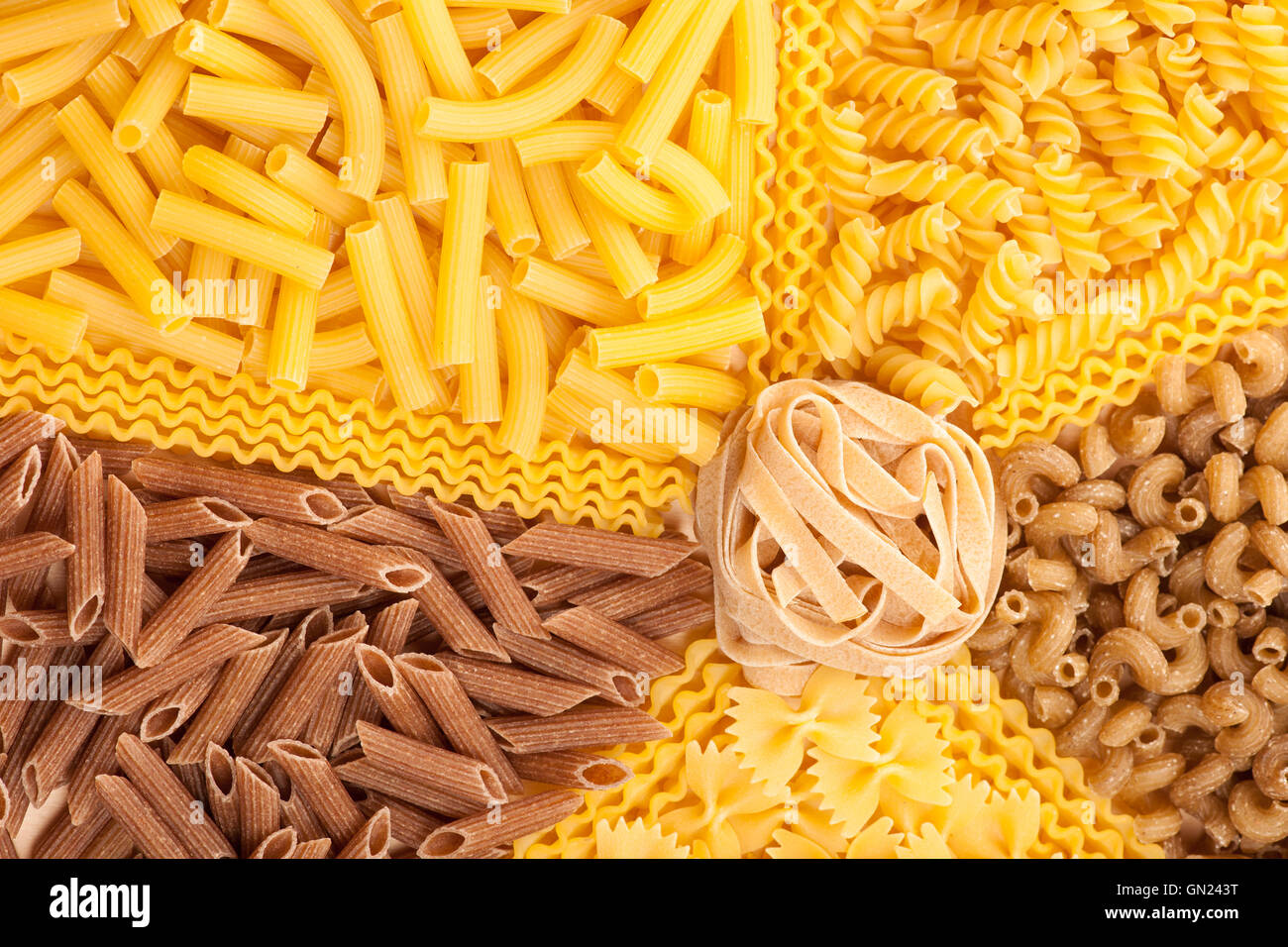 Assortment of italian pasta, five different varieties separated with ...
