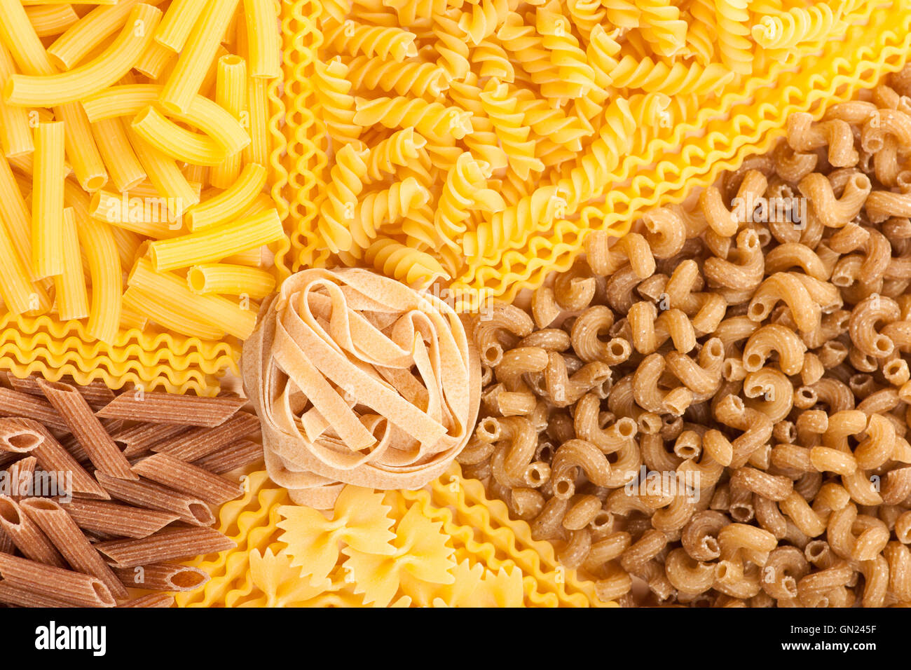 Assortment of italian pasta, five different varieties separated with ...
