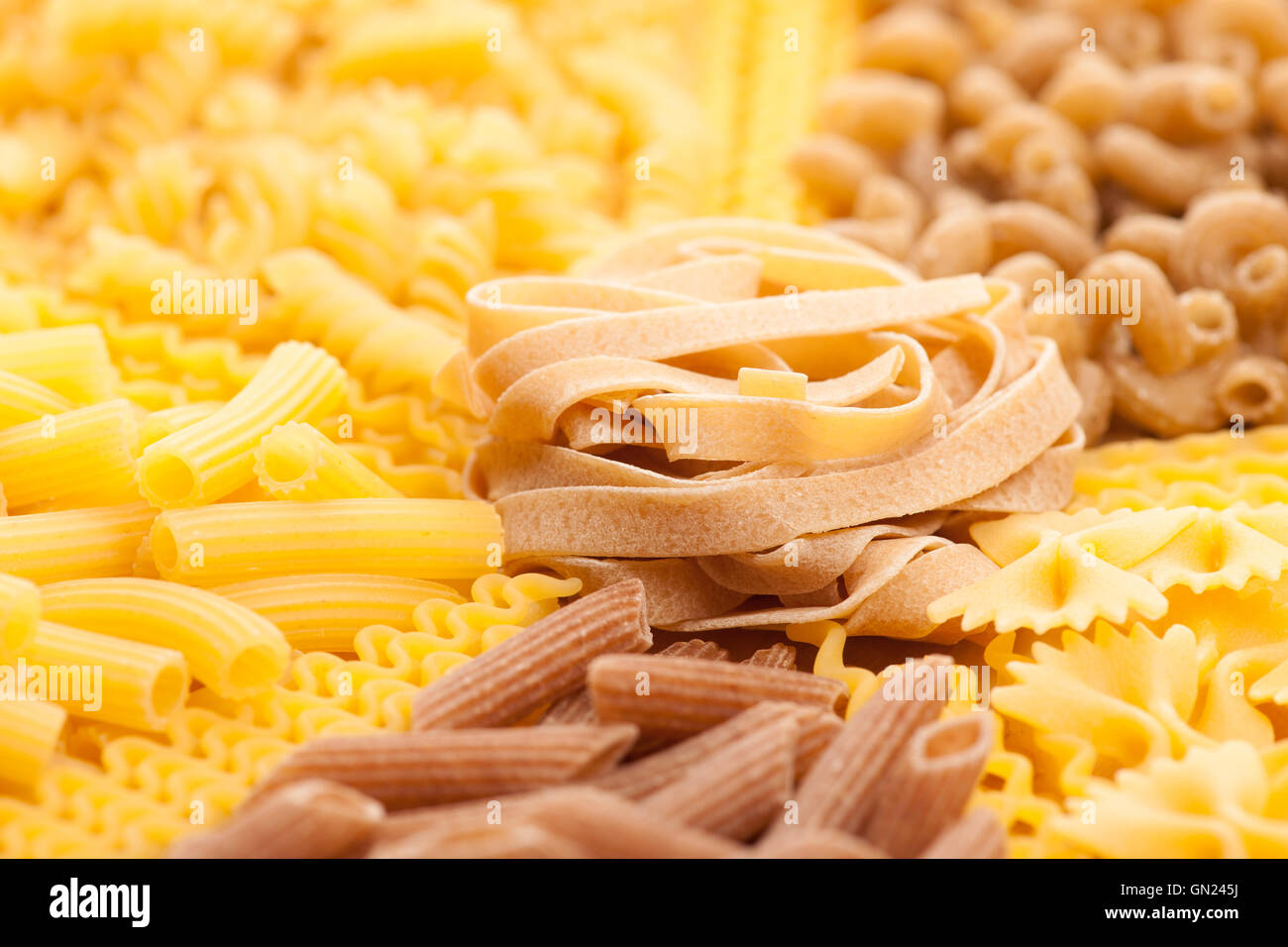 Assortment of italian pasta, five different varieties separated with ...