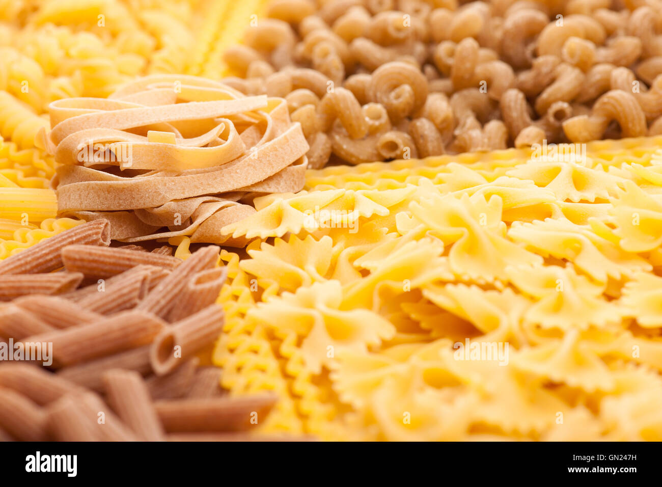 Assortment of italian pasta, five different varieties separated with ...