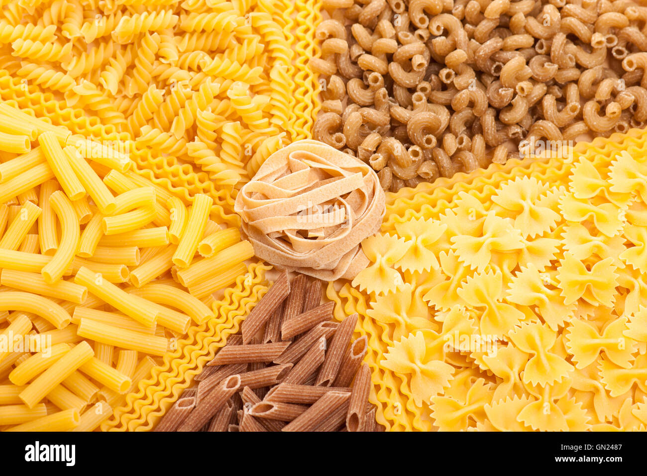 Assortment of italian pasta, five different varieties separated with ...