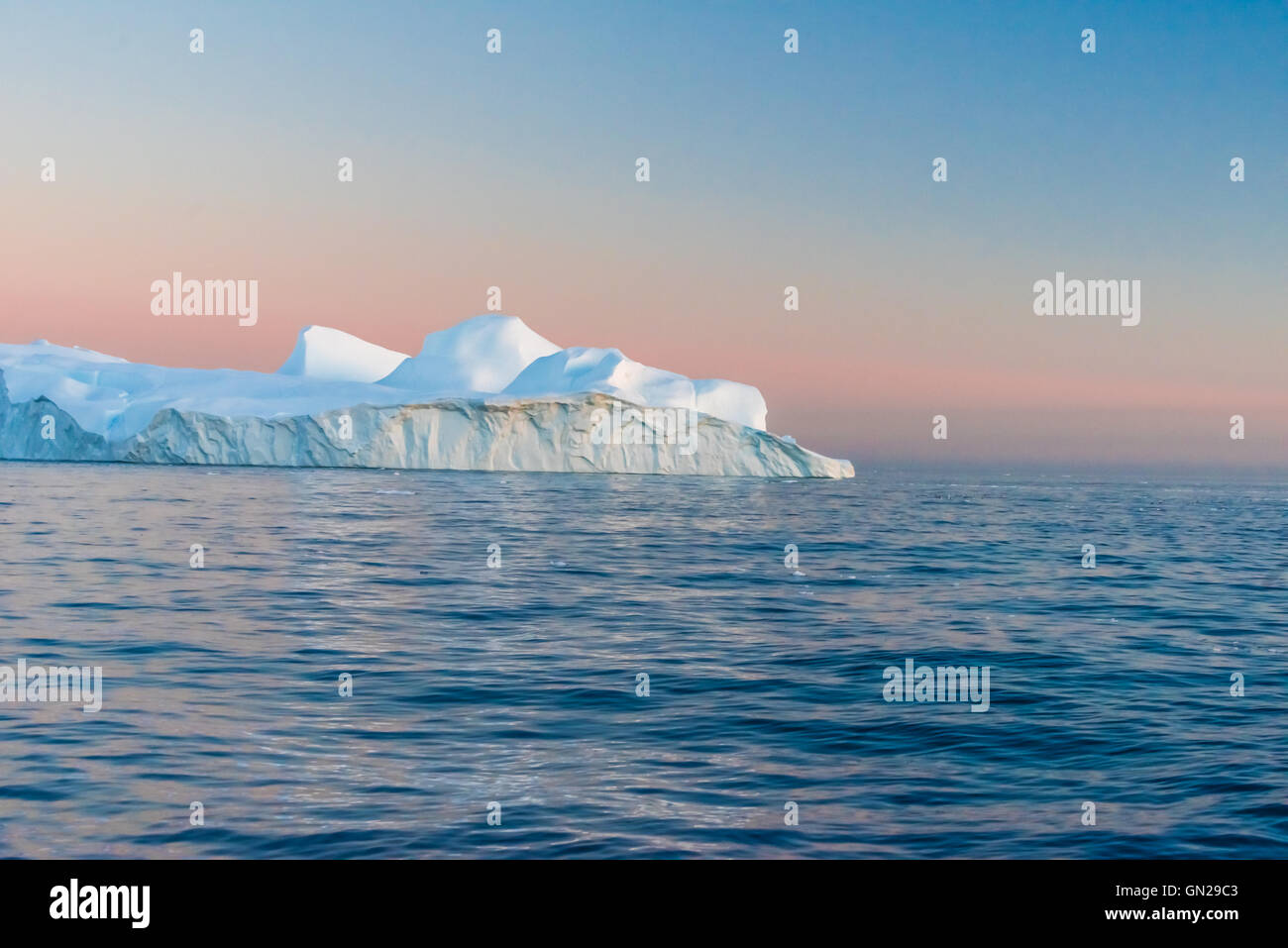 Stunning iceberg landscape with the midnight sun colors at the mouth of ...