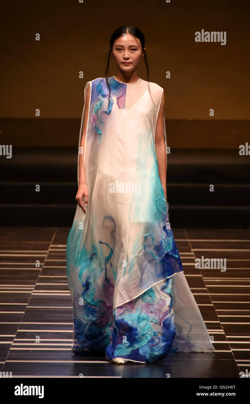 Guangzhou, China's Guangdong Province. 27th Aug, 2016. A model presents ...