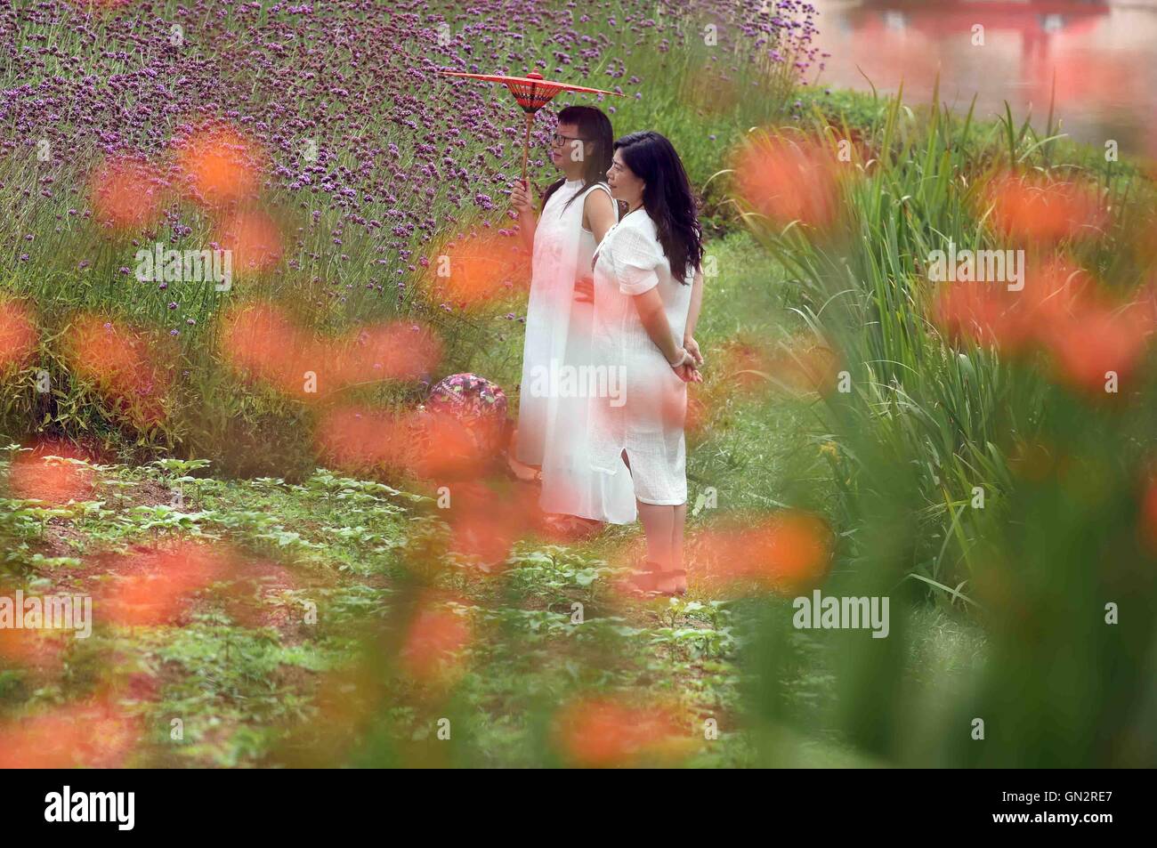 Qujing, China's Yunnan Province. 28th Aug, 2016. Tourists pose for ...