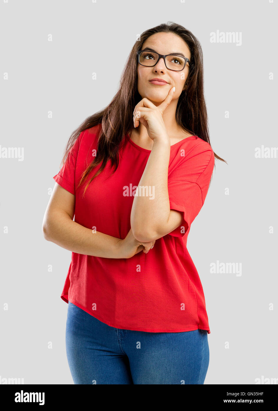 Beautiful and lovely woman making a thinking expression Stock Photo - Alamy
