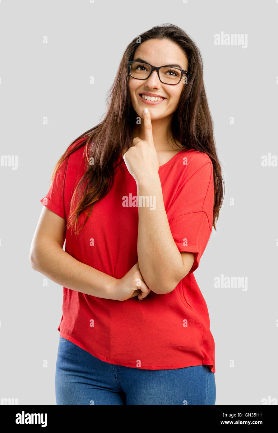 Beautiful and lovely woman making a thinking expression Stock Photo - Alamy