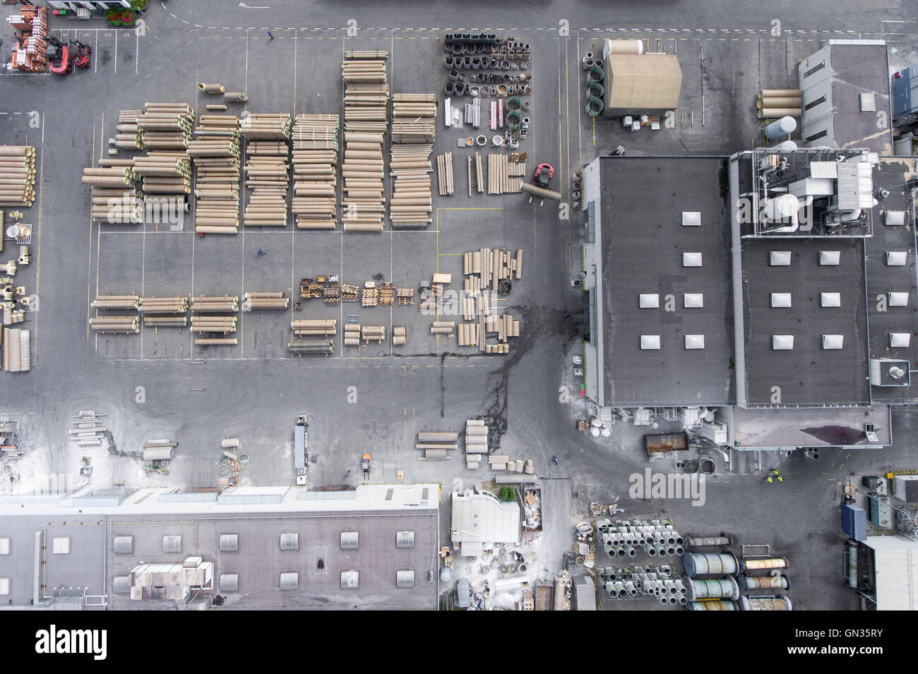 Industrial concrete drainage pipes stacked for construction. New tubes ...