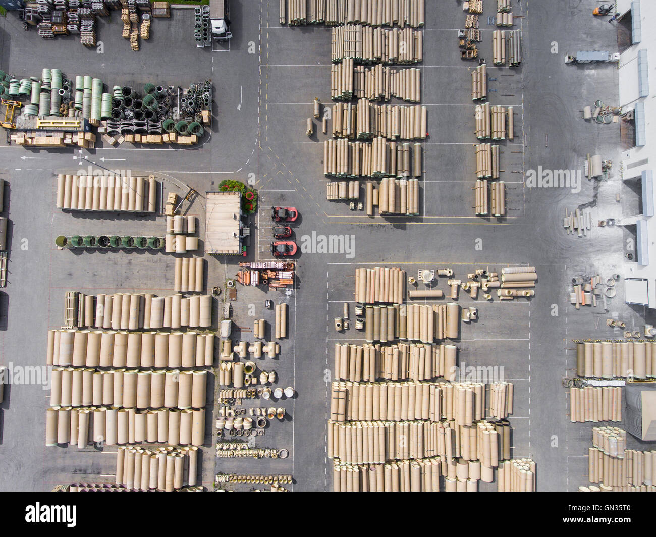 Industrial concrete drainage pipes stacked for construction. New tubes ...