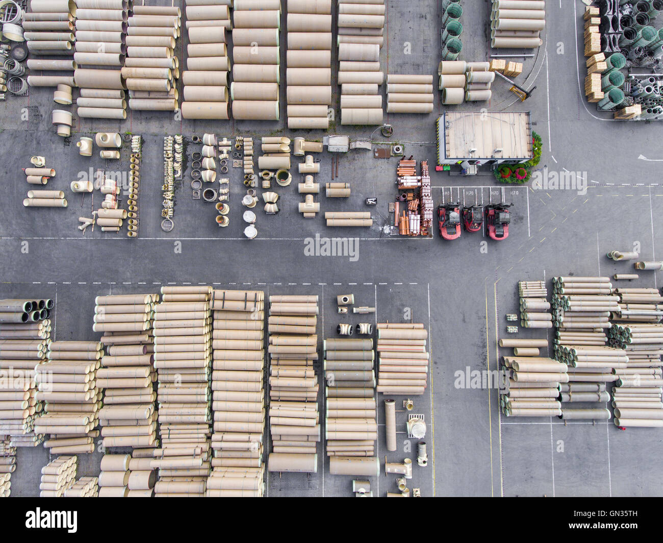 Industrial concrete drainage pipes stacked for construction. New tubes ...