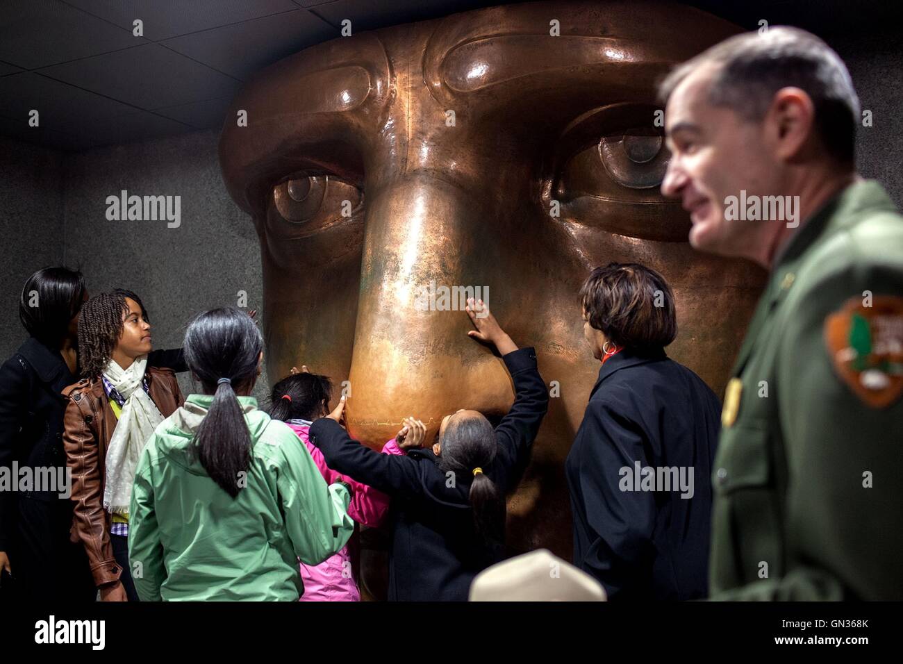 U.S First Lady Michelle Obama and daughters Sasha and Malia touch the ...