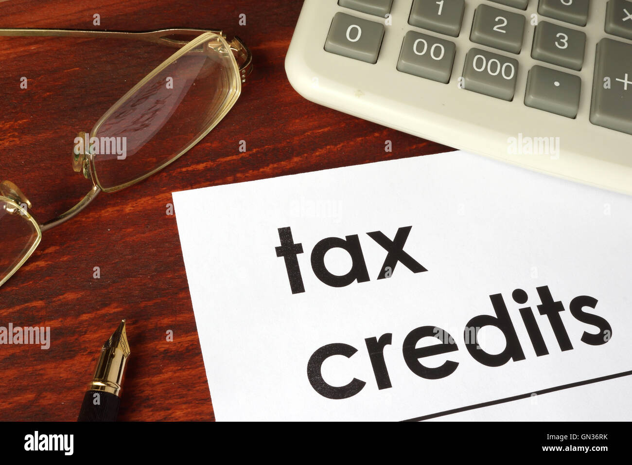 Paper with words tax credits on a wooden background Stock Photo - Alamy