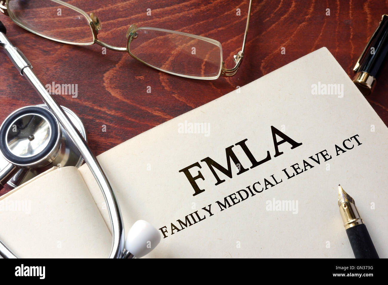 Page with FMLA family medical leave act on a table Stock Photo - Alamy