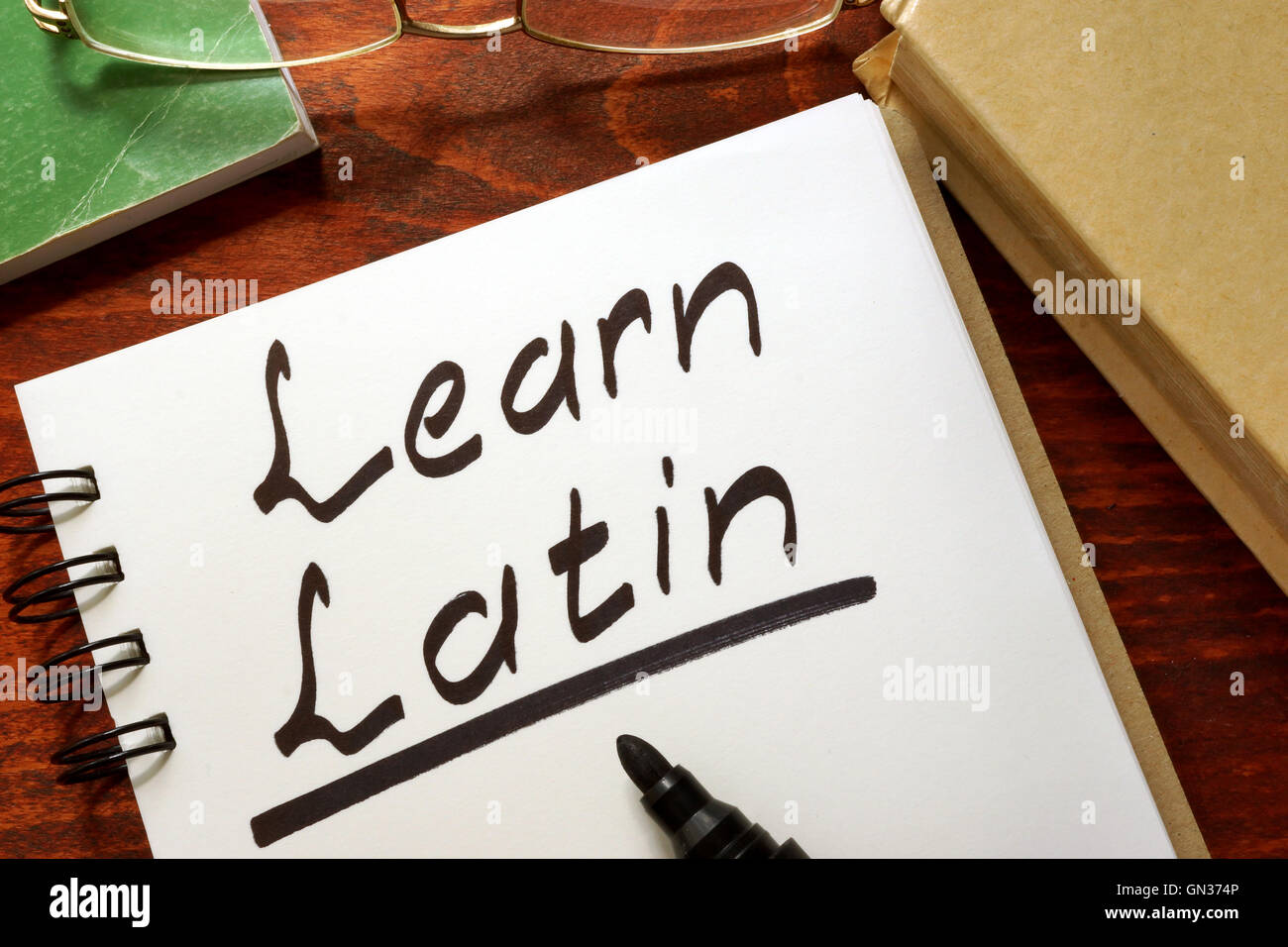 Learn latin written in a notepad. Education concept Stock Photo - Alamy