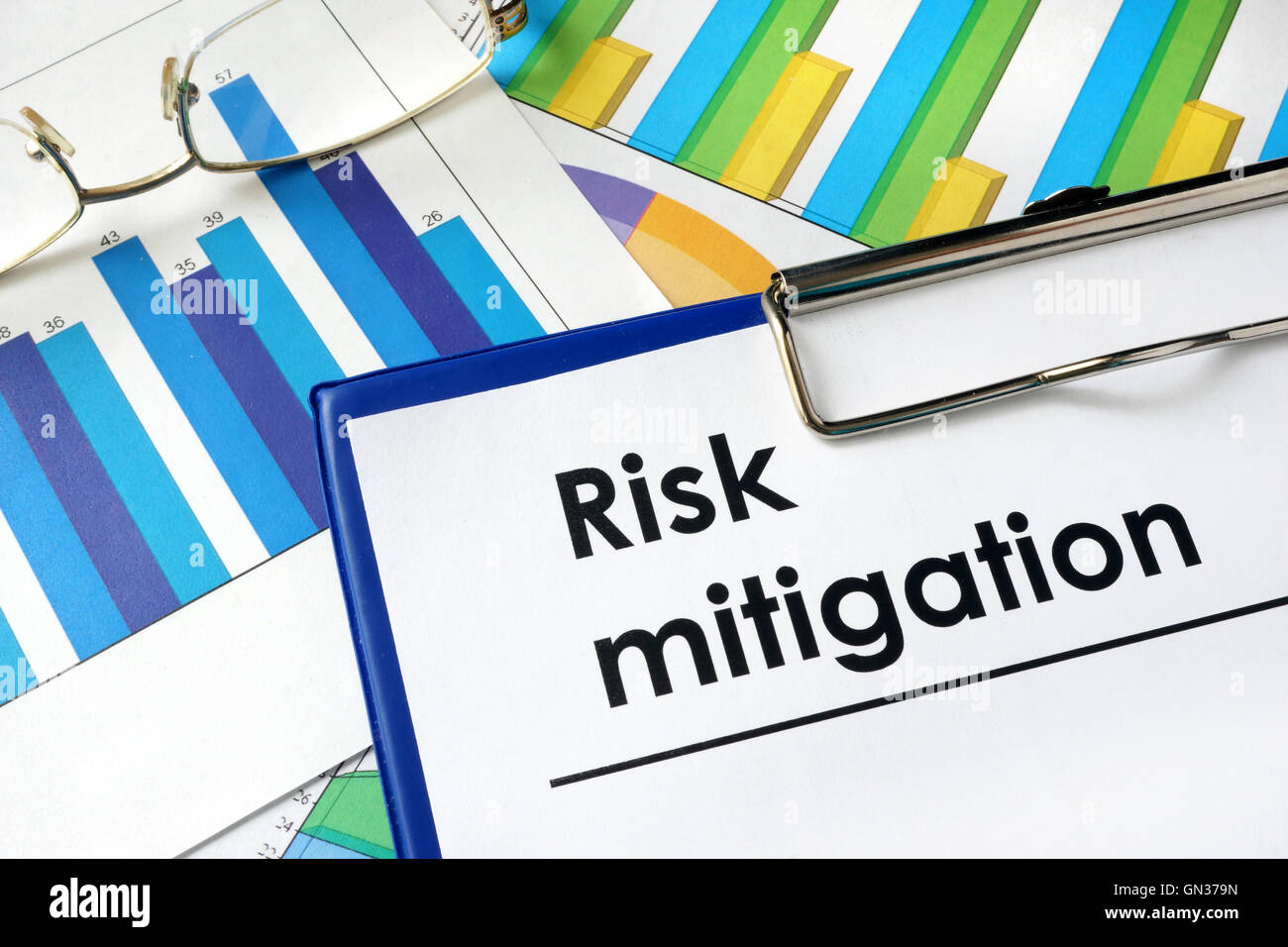 Paper with words Risk mitigation and charts Stock Photo - Alamy