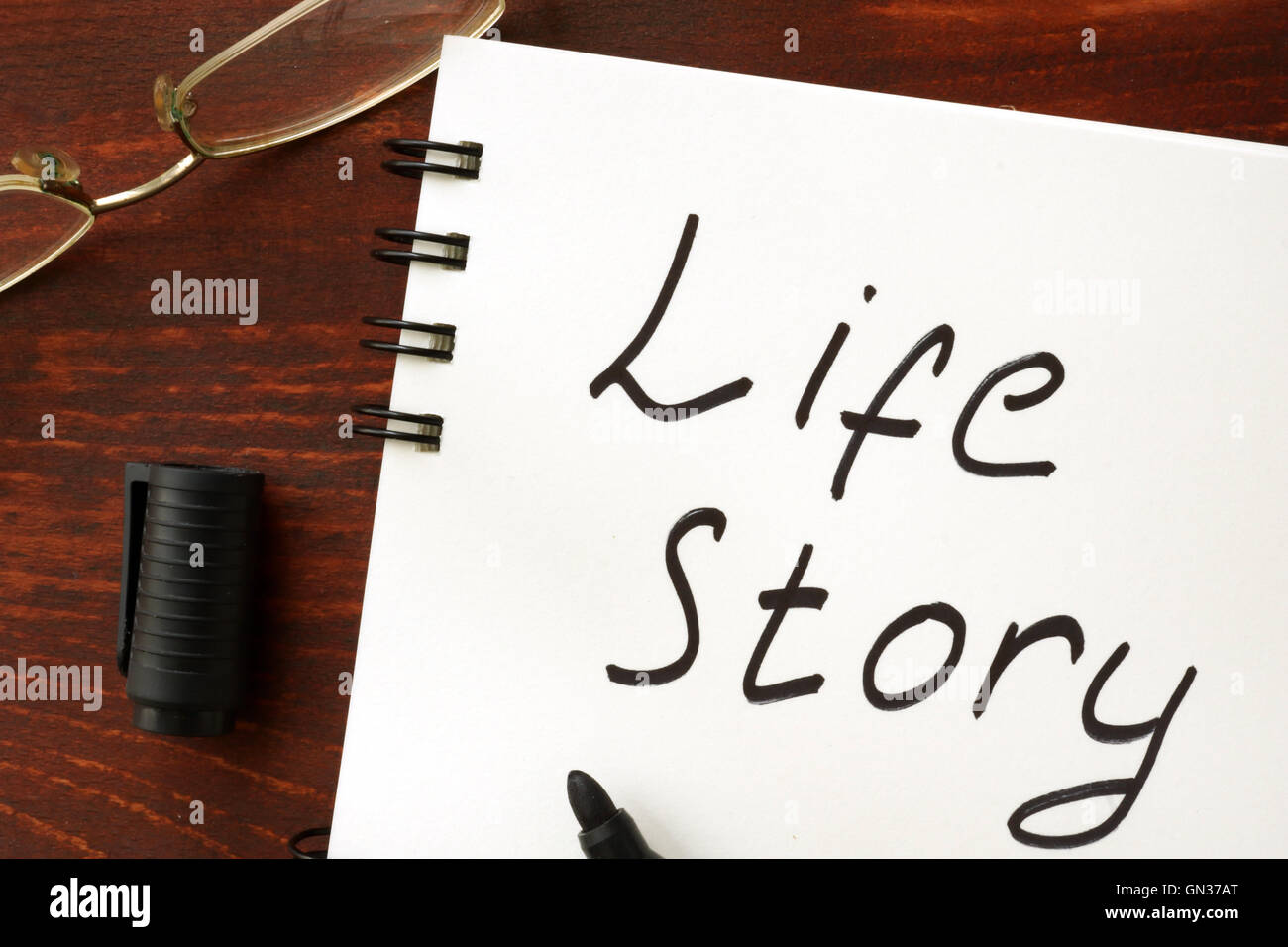 Life story sign written in a notepad Stock Photo - Alamy
