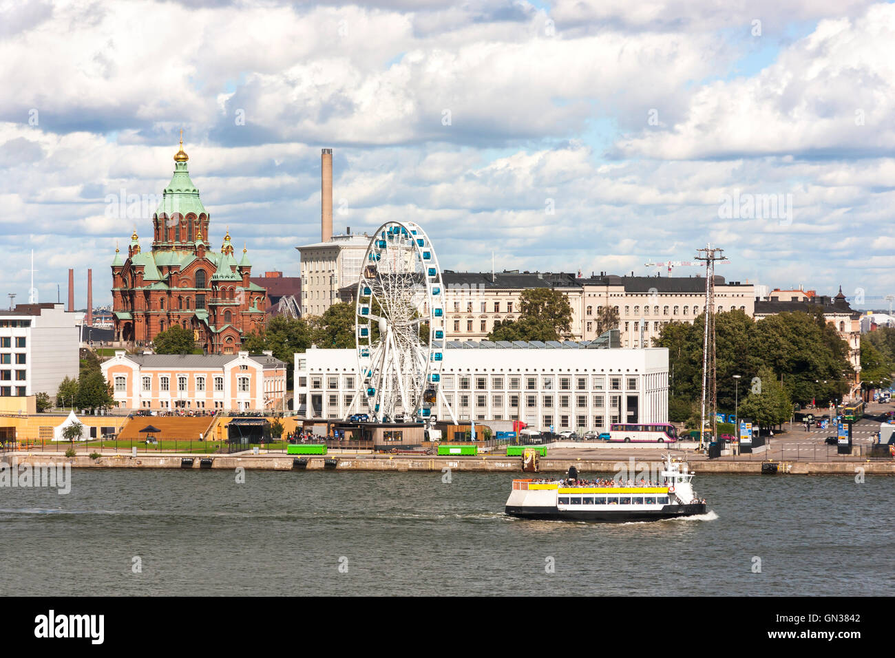 Cityscape of Helsinki, capital of Finland, with a church and ferris ...