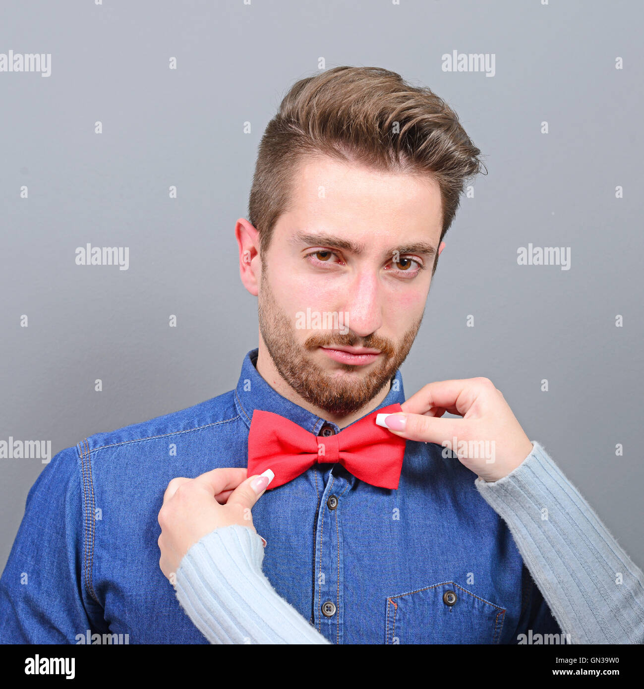 Woman adjusting shirt collar hi-res stock photography and images - Alamy