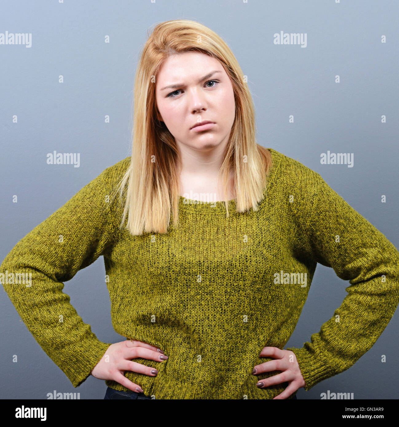 Portrait of mad woman against gray background Stock Photo - Alamy