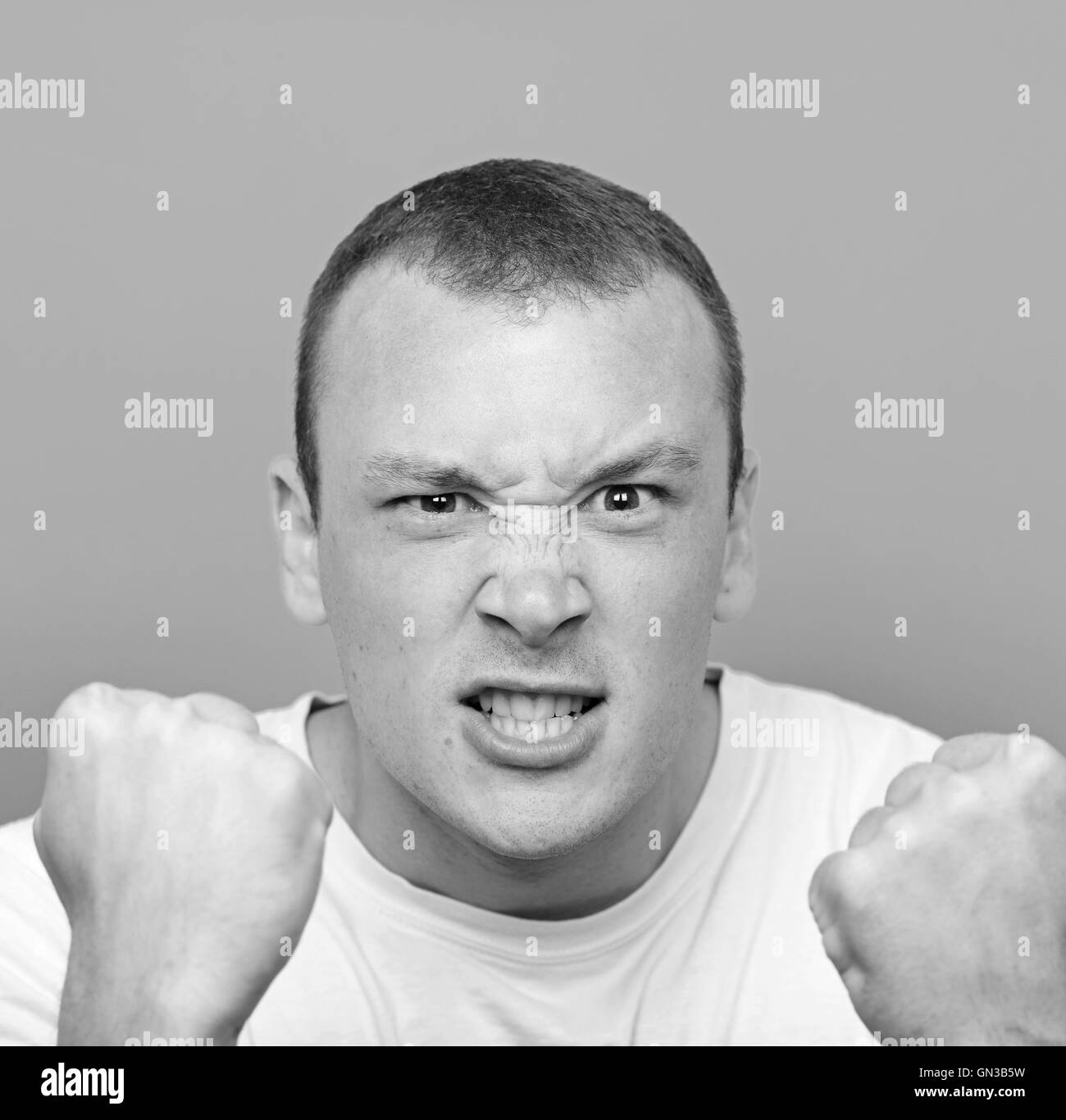 Studio portrait against red Black and White Stock Photos & Images - Alamy