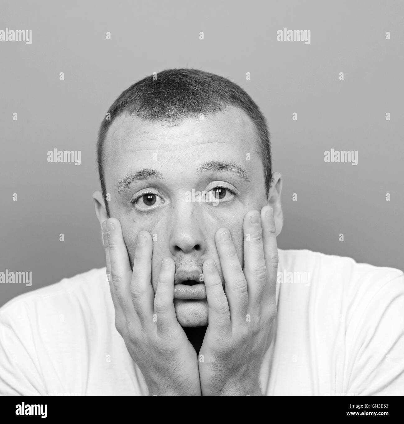 Portrait of desperate man against yellow background Stock Photo - Alamy