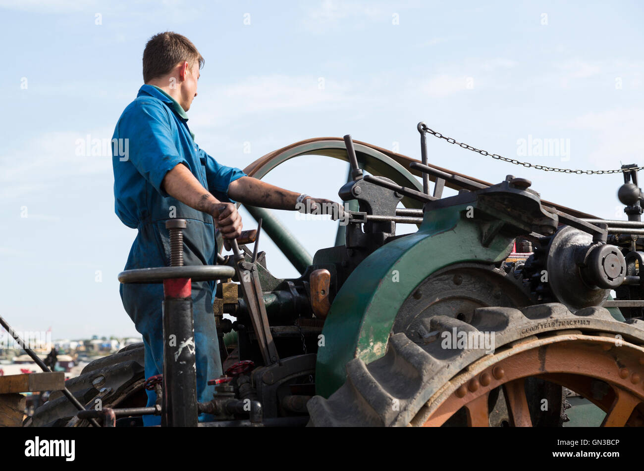 Man operating a steam engine at dorset steam fair Stock Photo - Alamy