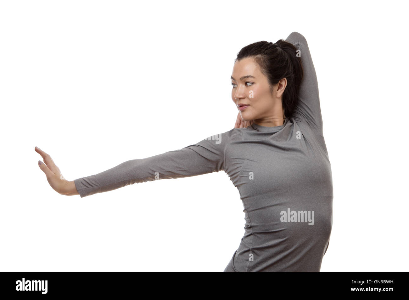fitness woman stretching her arms shot in the studio Stock Photo - Alamy