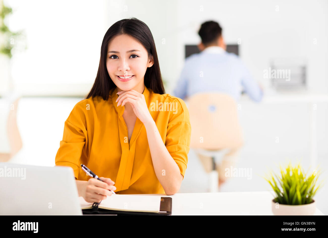 young beautiful business woman working in office Stock Photo - Alamy