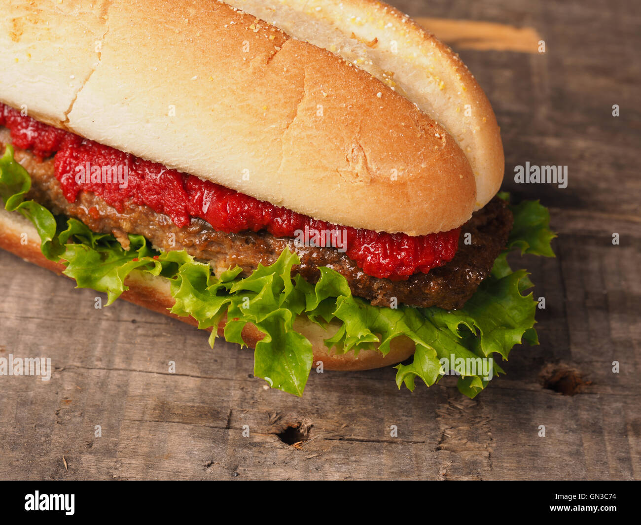 Fresh tasty burger on a rustic wooden table, view from above Stock ...