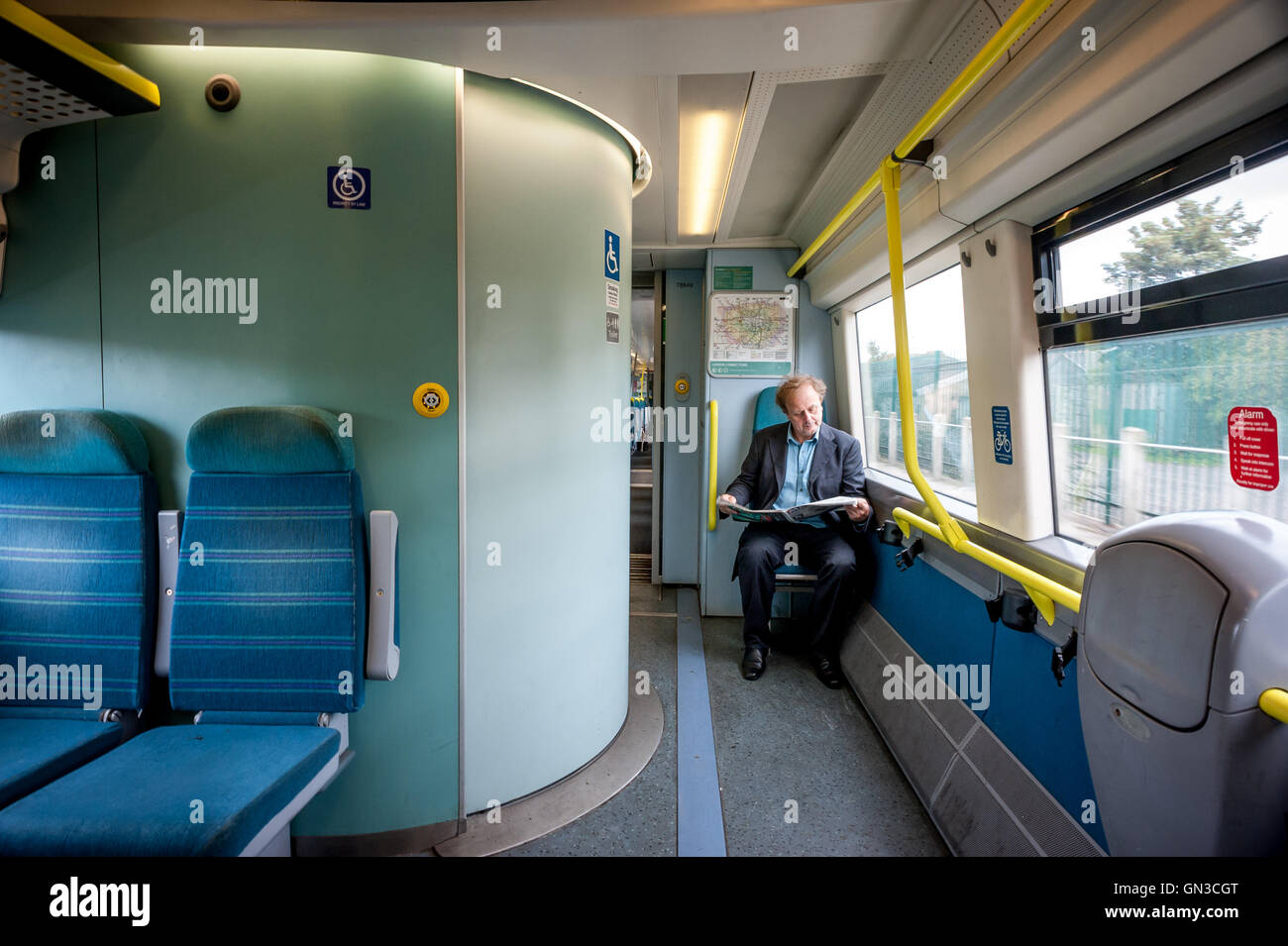 A passenger using the onboard toilet facilities on a train Stock Photo ...