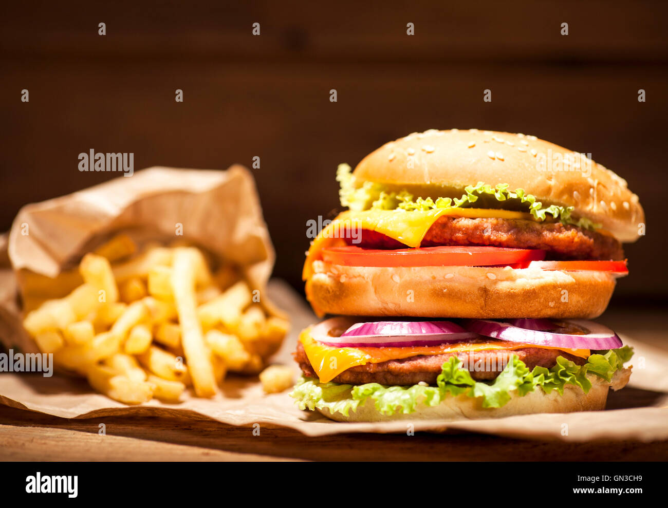 Fresh burger on wooden background Stock Photo - Alamy