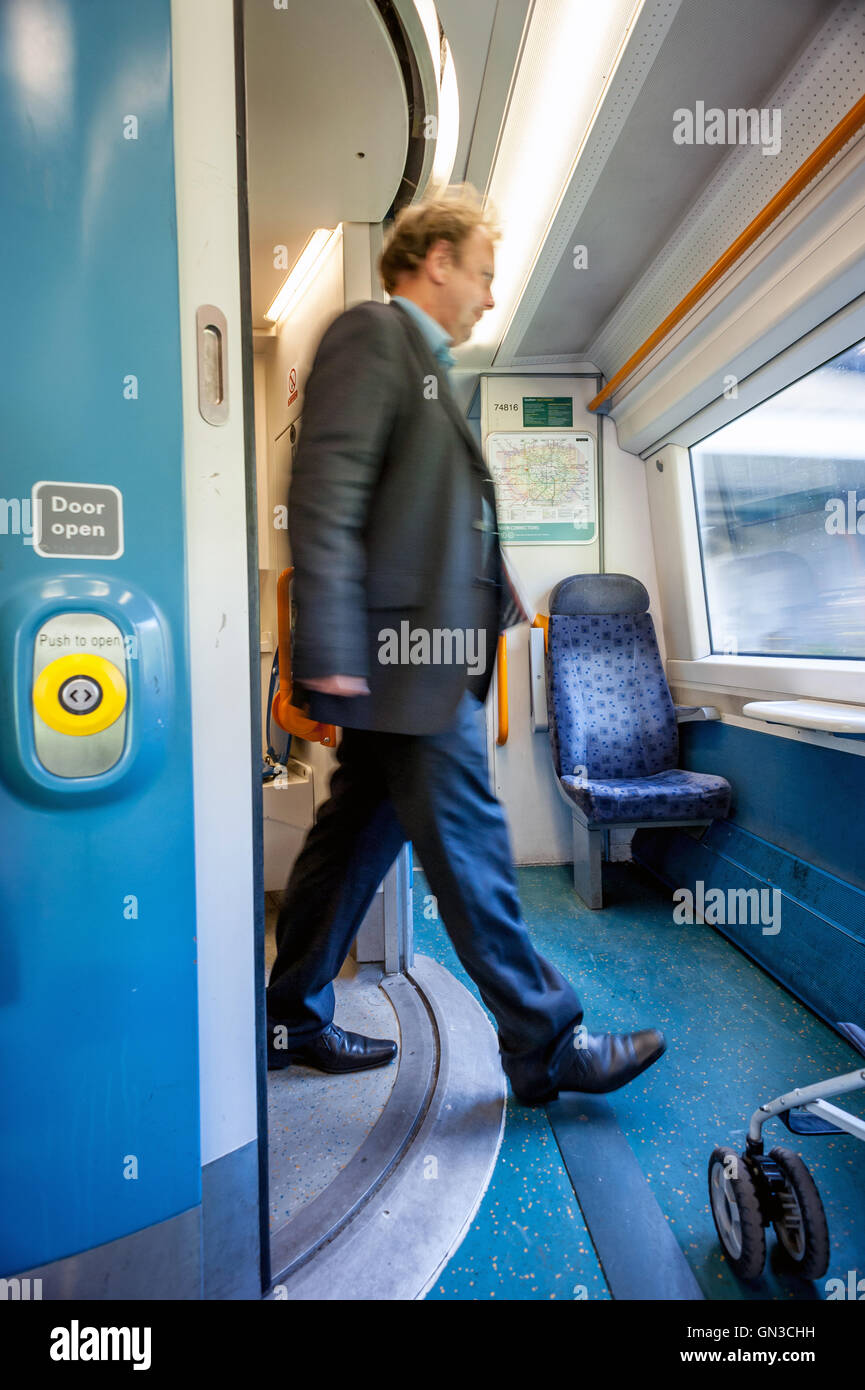 A passenger using the onboard toilet facilities on a train Stock Photo ...