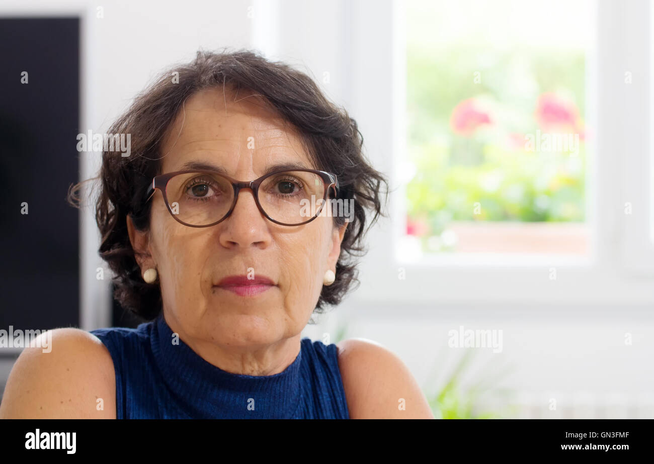 portrait of a beautiful mature woman with glasses Stock Photo - Alamy