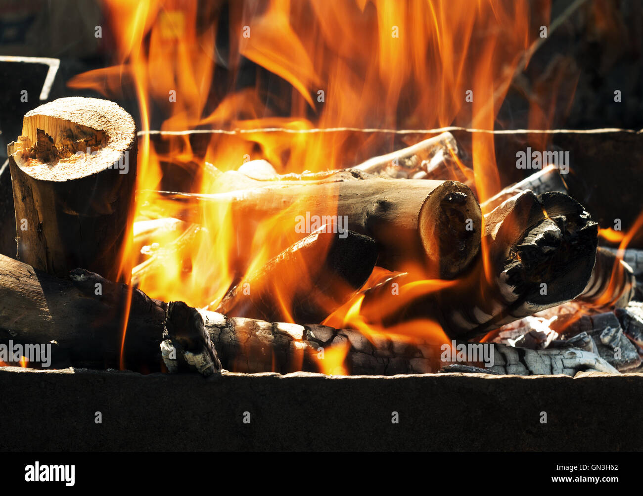 Firewood is burning in the char grill. Closeup of burning wood Stock ...