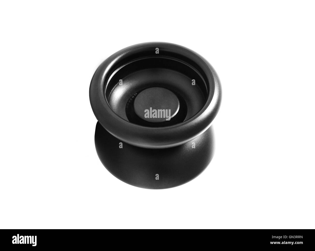 Black yo-yo toy on a white background Stock Photo - Alamy
