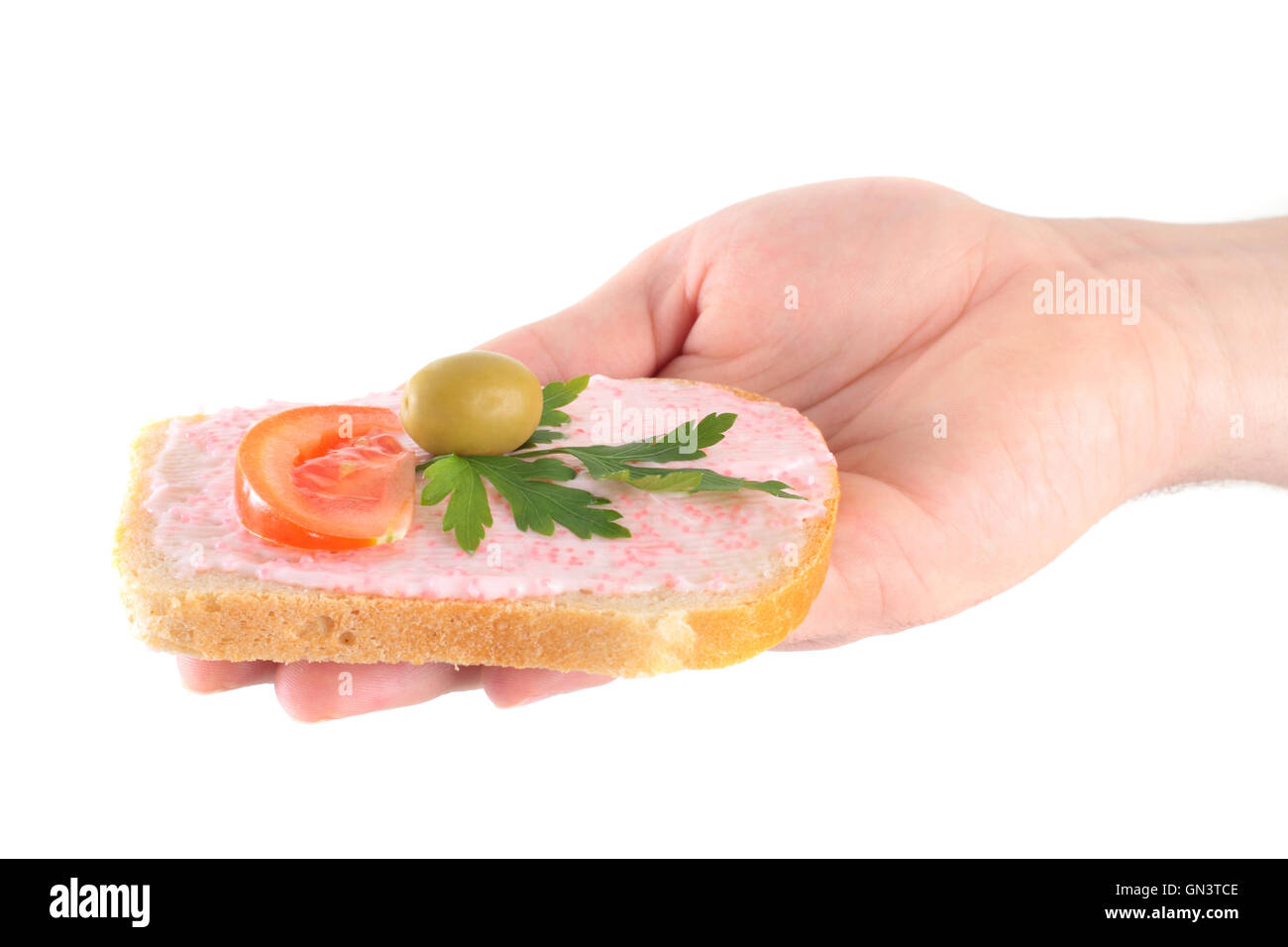 hand holding toast with fish caviar cream Stock Photo - Alamy