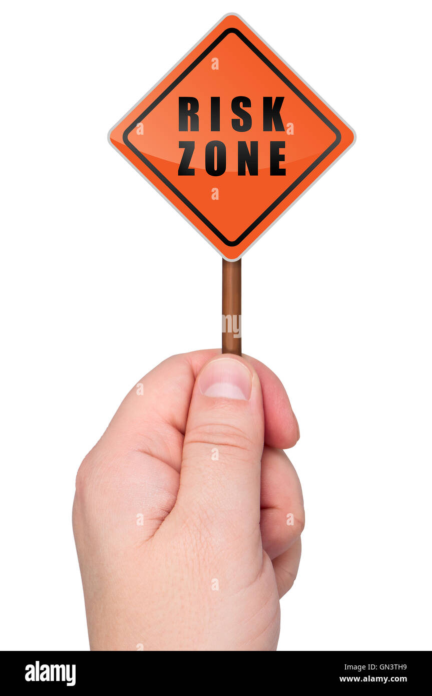 Warning sign risk zone holds in hand Stock Photo - Alamy