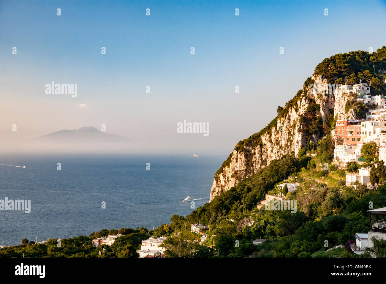 Late afternoon at Capri town with the volcano Vesuvius across the Bay ...