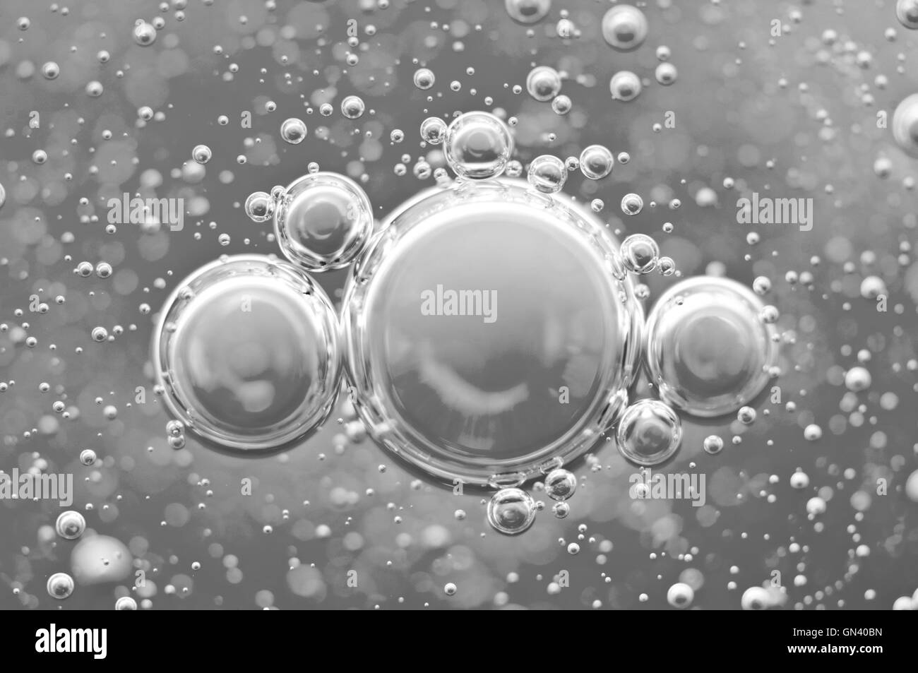 Black-and-white Macro Oxygen bubbles in water, concept such as ecology ...