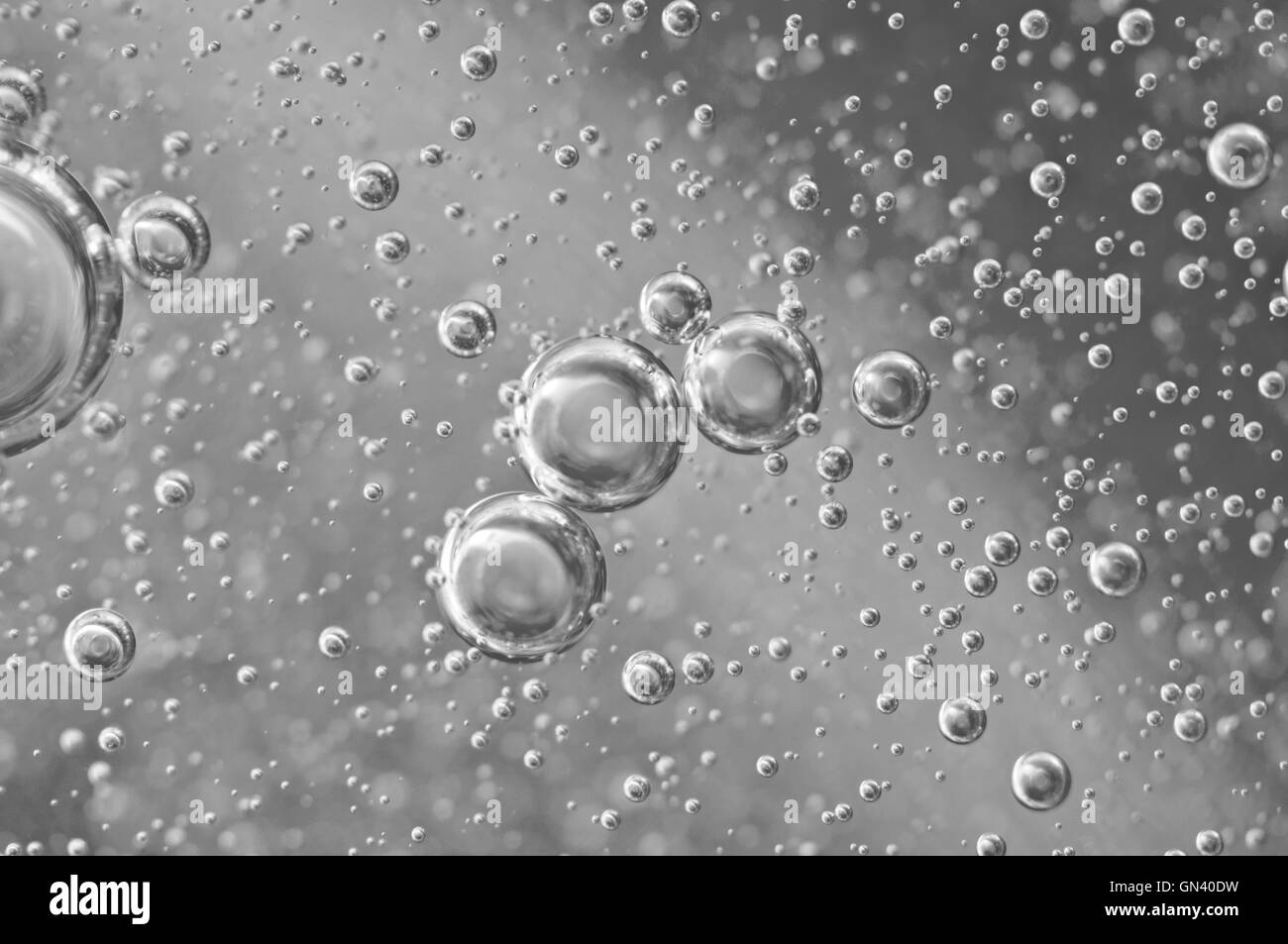 Black-and-white Macro Oxygen bubbles in water, concept such as ecology ...