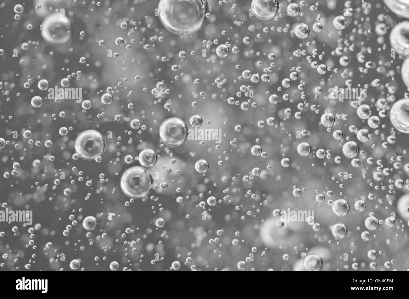 Black-and-white Macro Oxygen bubbles in water, concept such as ecology ...