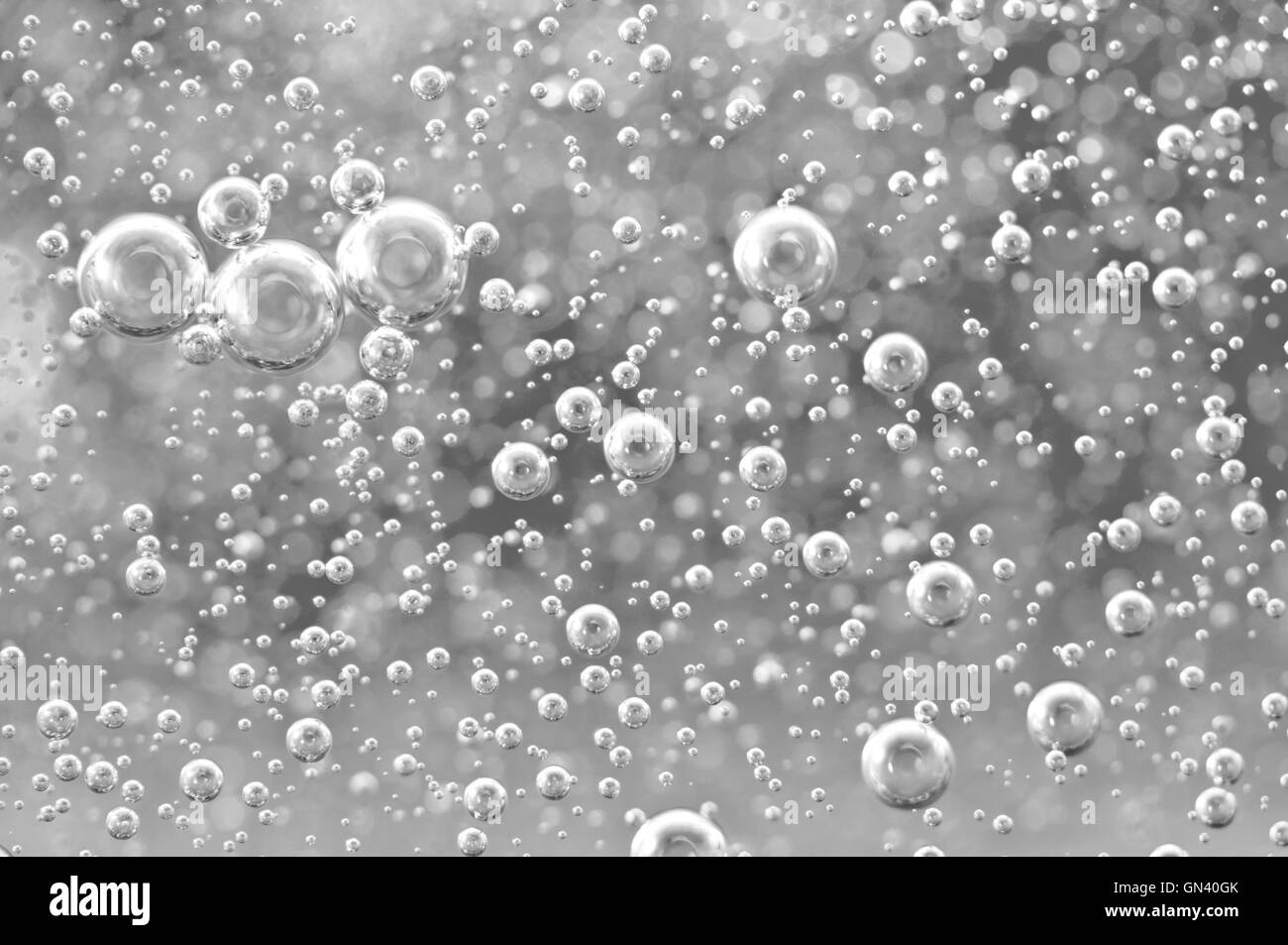 Black-and-white Macro Oxygen bubbles in water, concept such as ecology ...