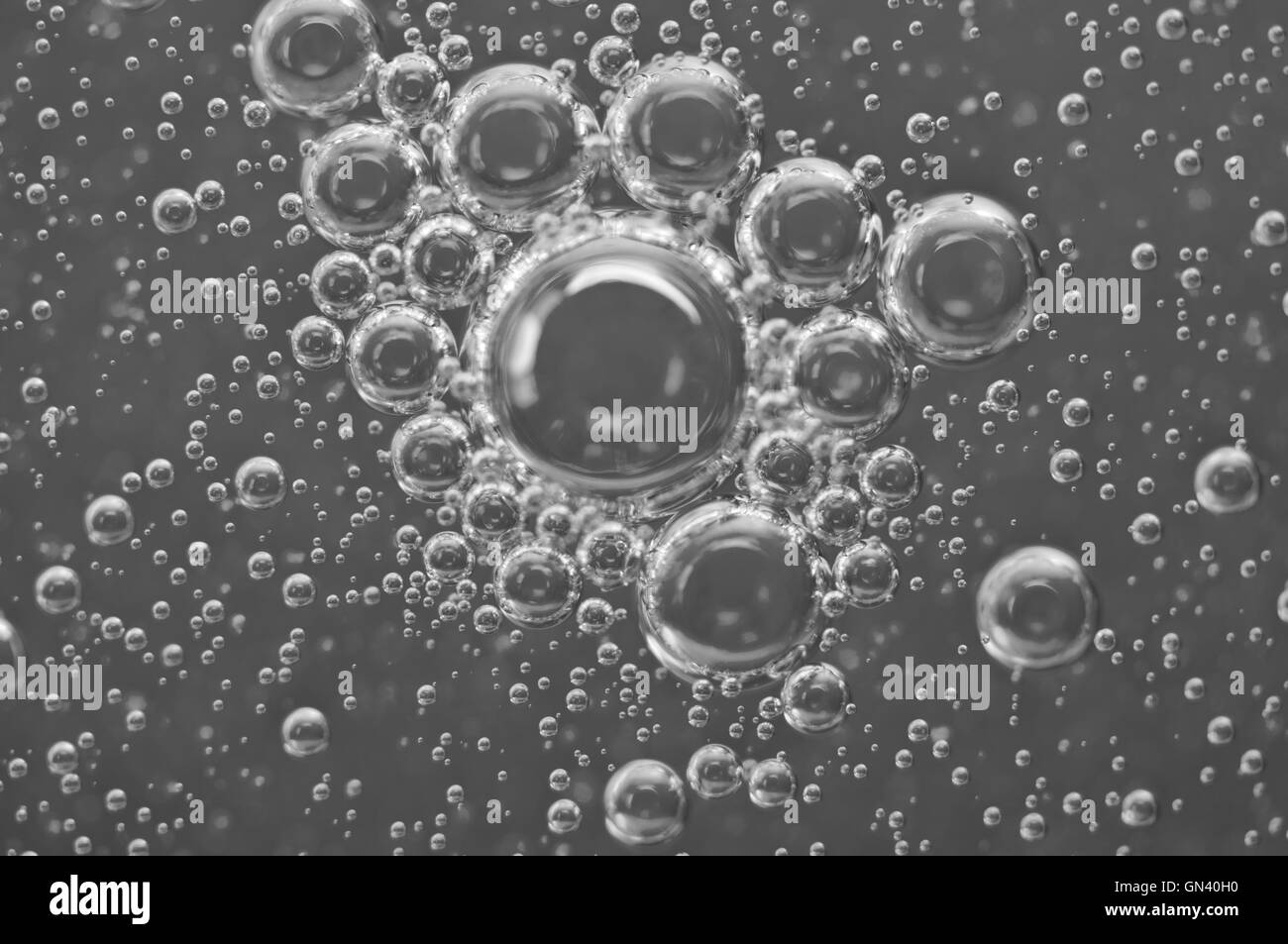 Black-and-white Macro Oxygen bubbles in water, concept such as ecology ...