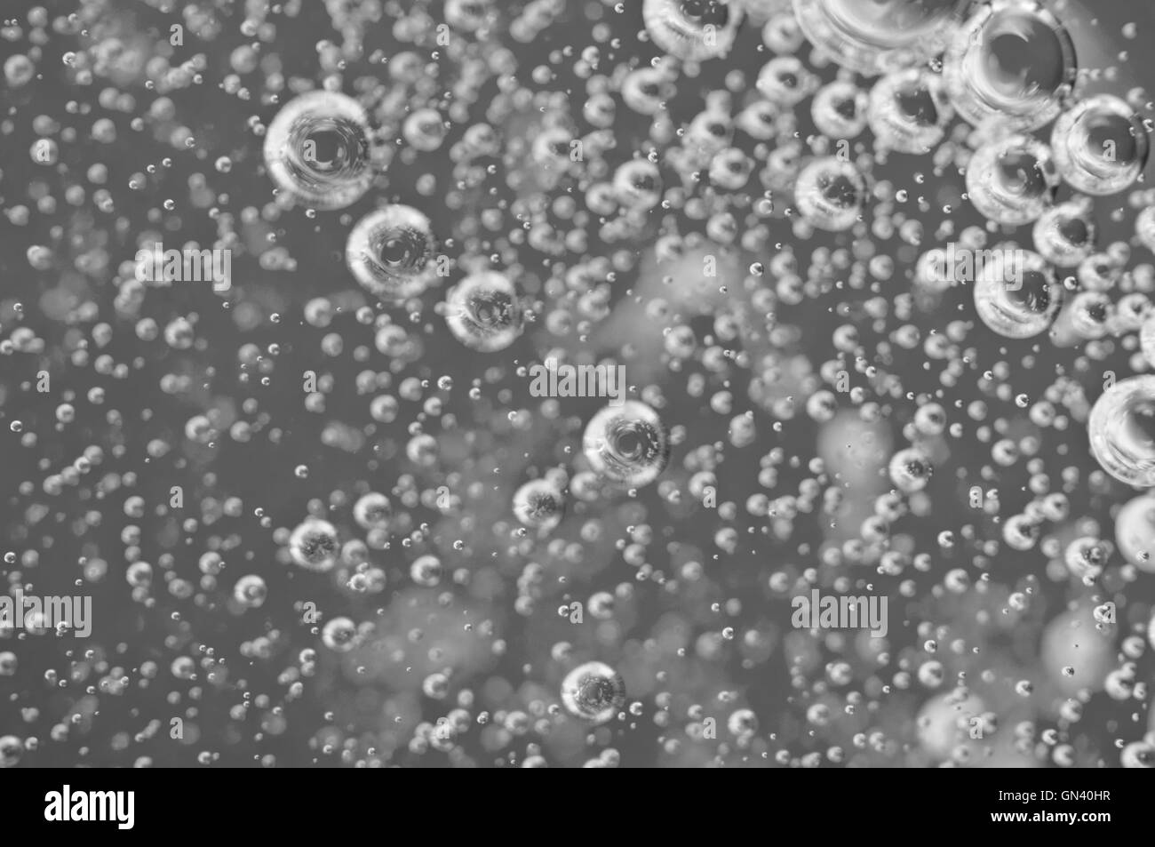 Black-and-white Macro Oxygen bubbles in water, concept such as ecology ...