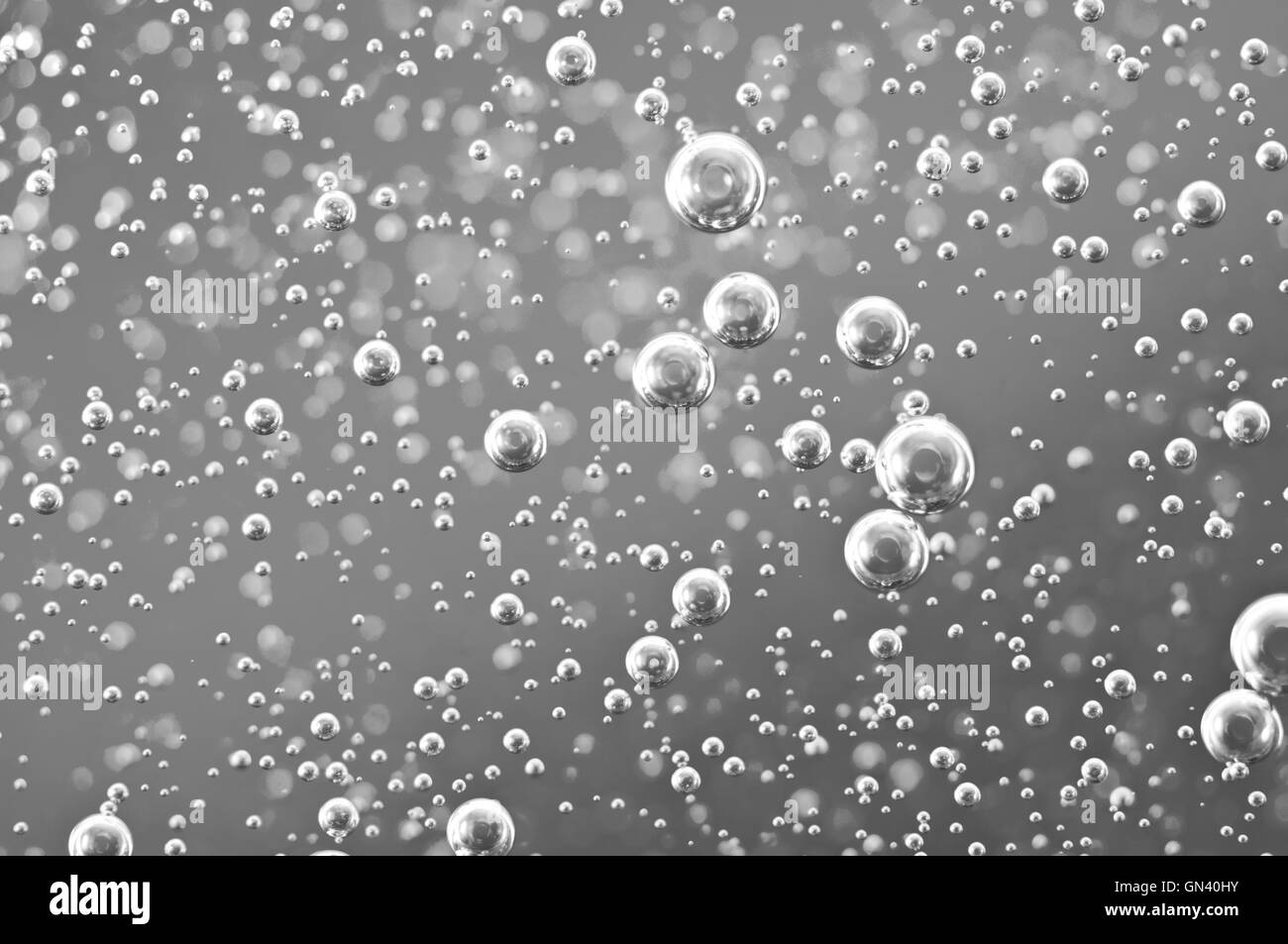 Black-and-white Macro Oxygen bubbles in water, concept such as ecology ...