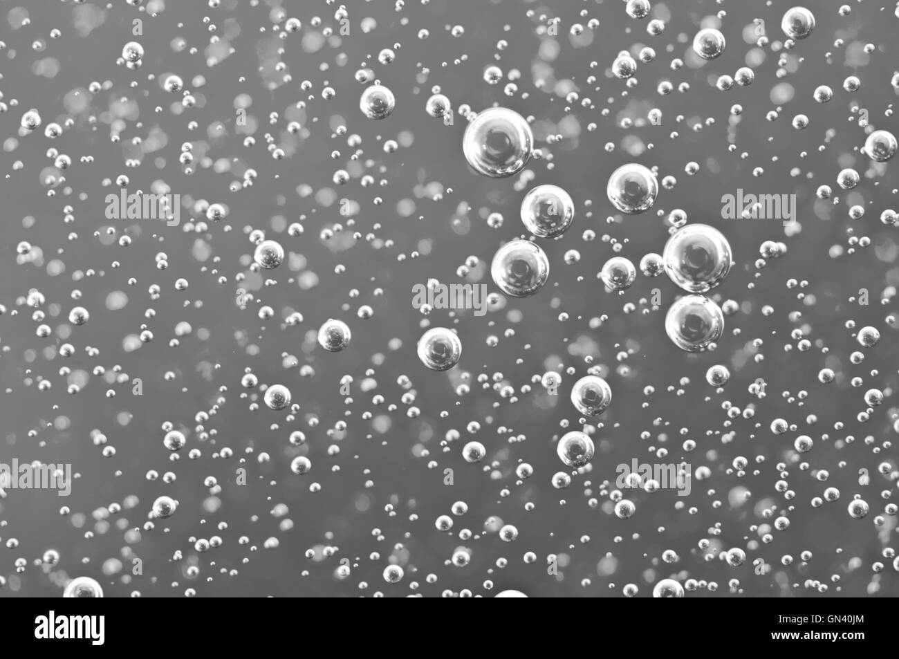 Black-and-white Macro Oxygen bubbles in water, concept such as ecology ...