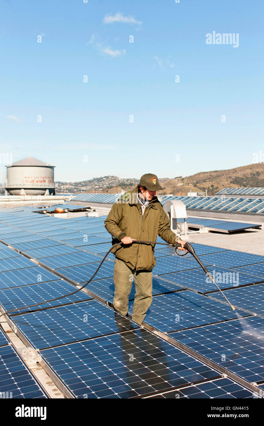 Ray Katsane a National Park Service employee power washes the solar ...