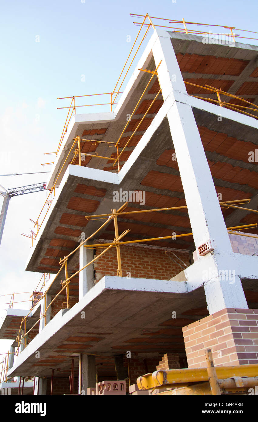 Buildings under construction at sunset Stock Photo - Alamy